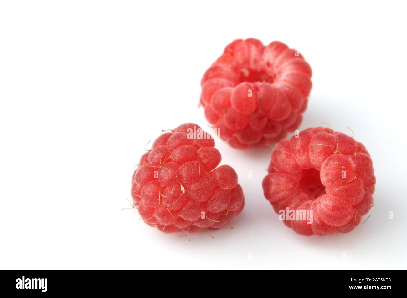 Red ripe raspberries isolated on white Stock Photo - Alamy