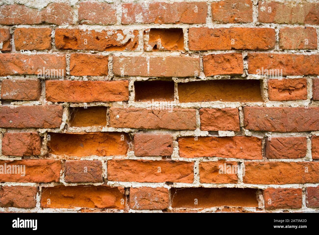 Texture of a very old crumbling brick wall. Part of an antique building ...