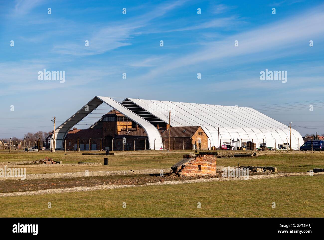 A picture of the main gate of Auschwitz II - Birkenau as it prepares ...
