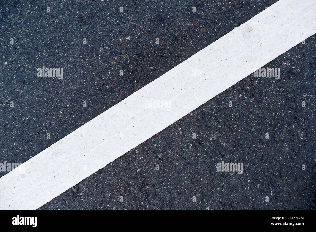 close-up diagonal white marking line on asphalt Stock Photo - Alamy