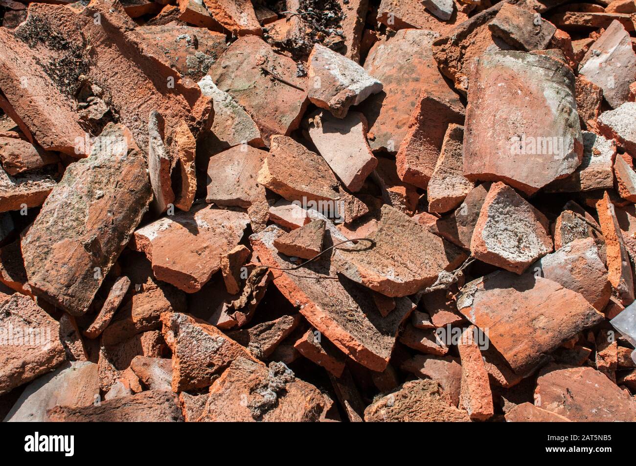 Crushed old ceramic red roof tiles closeup as grunge background Stock ...
