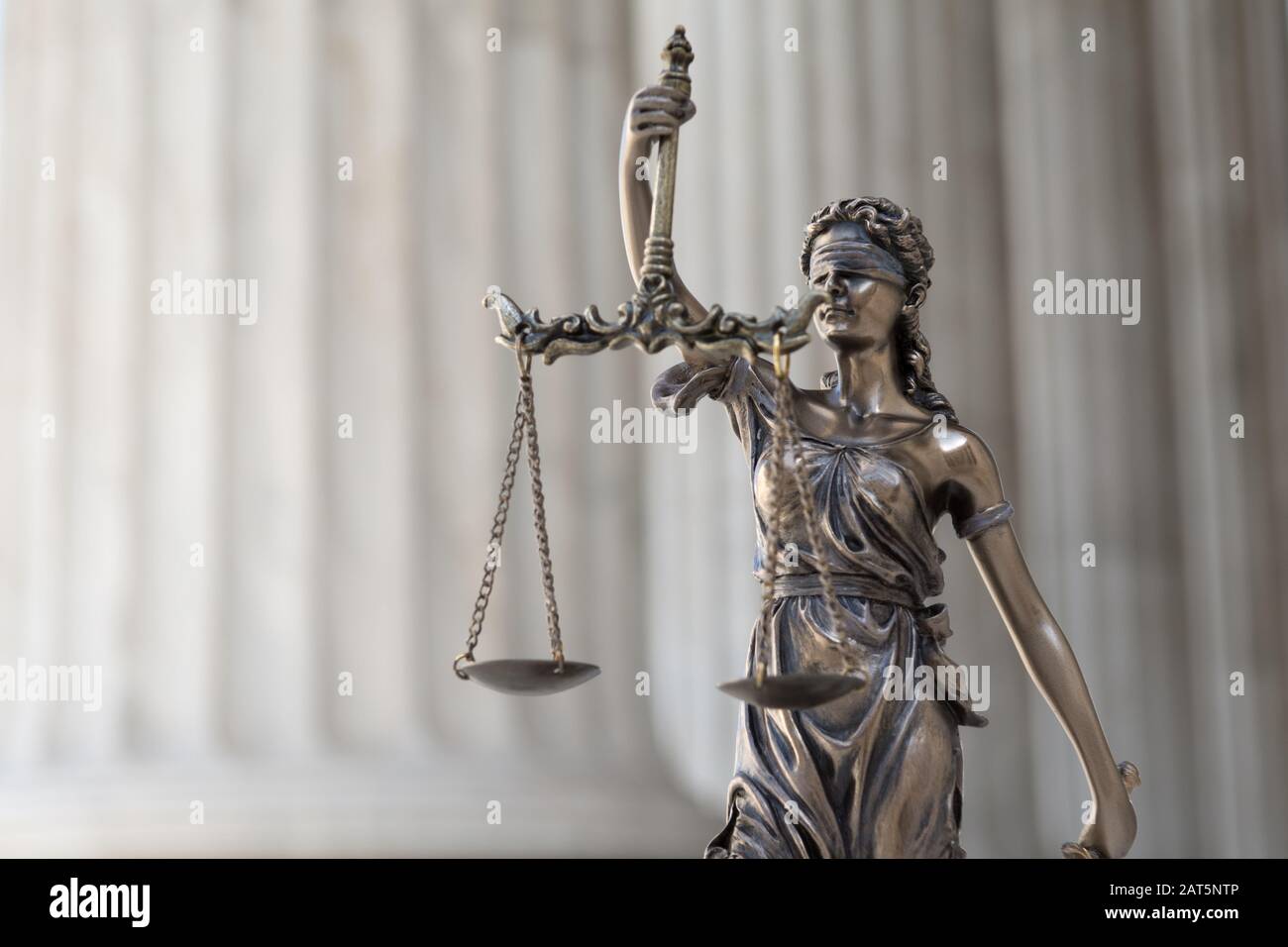 The statue of justice Themis or Justitia, the blindfolded goddess of ...