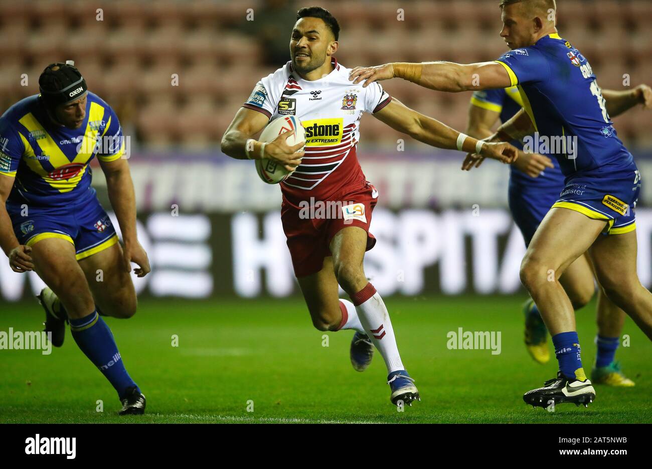 Wigan Warriors Bevan French breaks free from Warrington Wolves' Mike ...