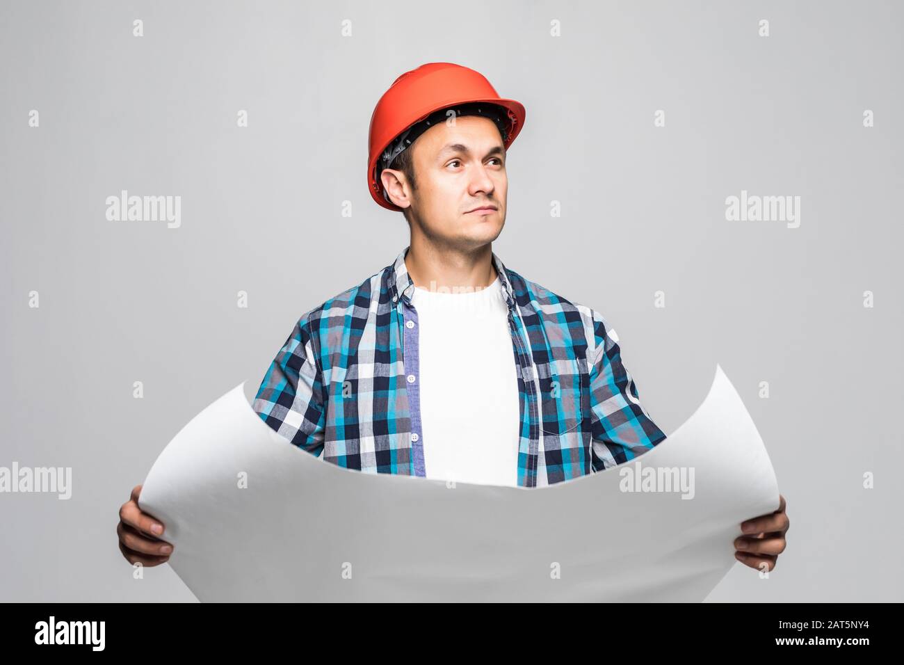 Engineer with blueprints isolated on white background Stock Photo - Alamy