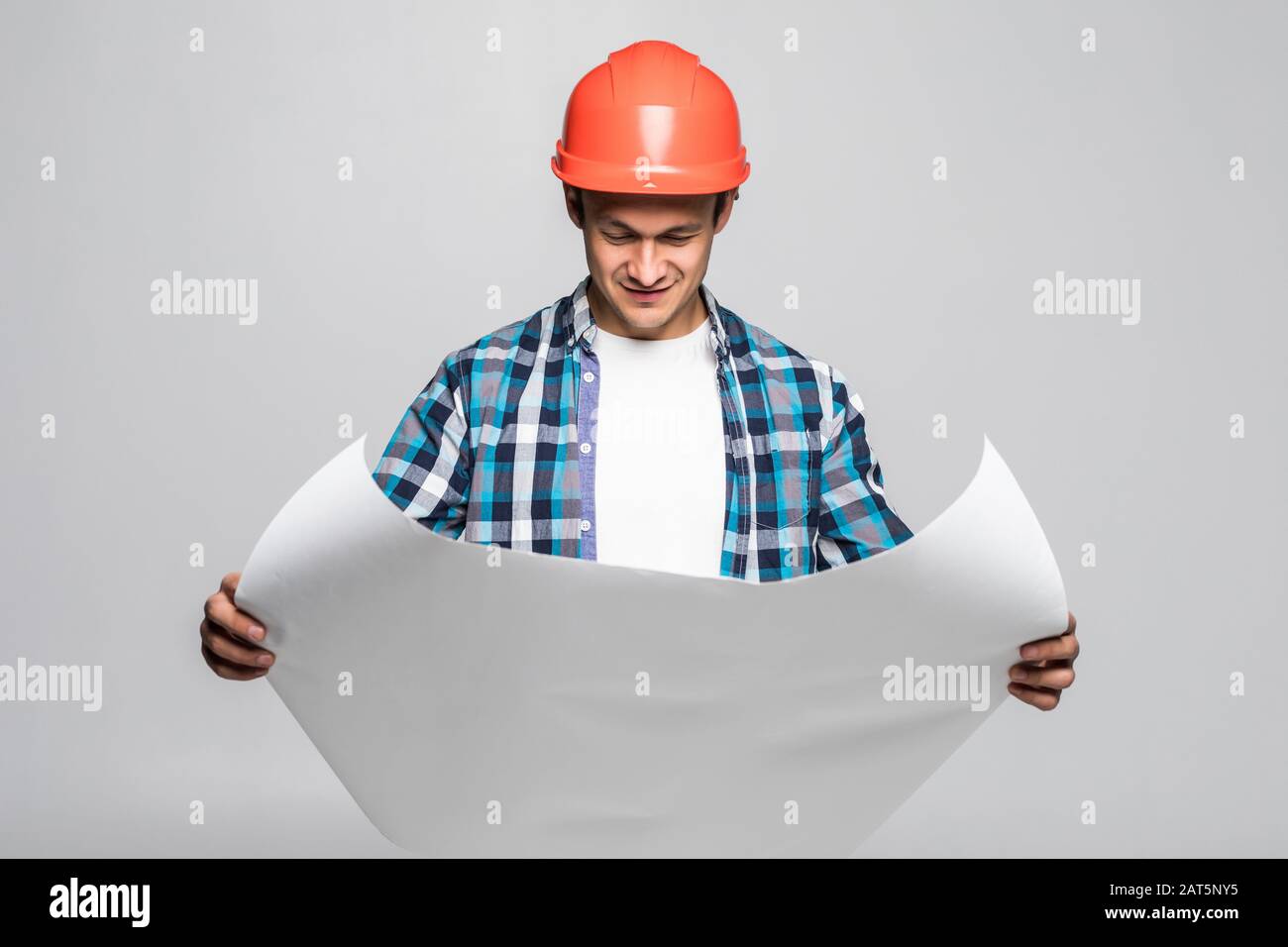 Engineer with blueprints isolated on white background Stock Photo - Alamy