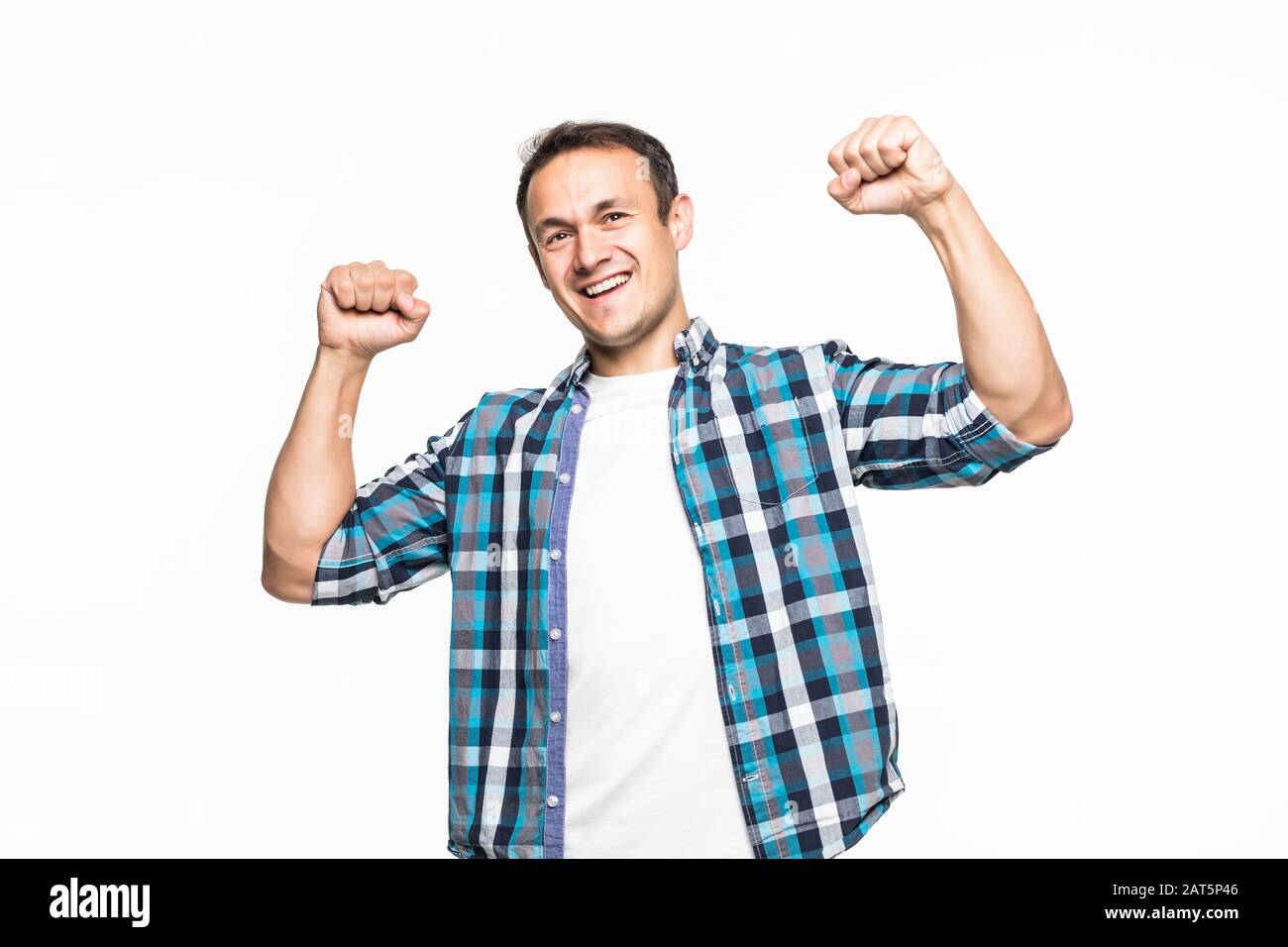 Happy winner. Happy young handsome man gesturing and keeping mouth open ...