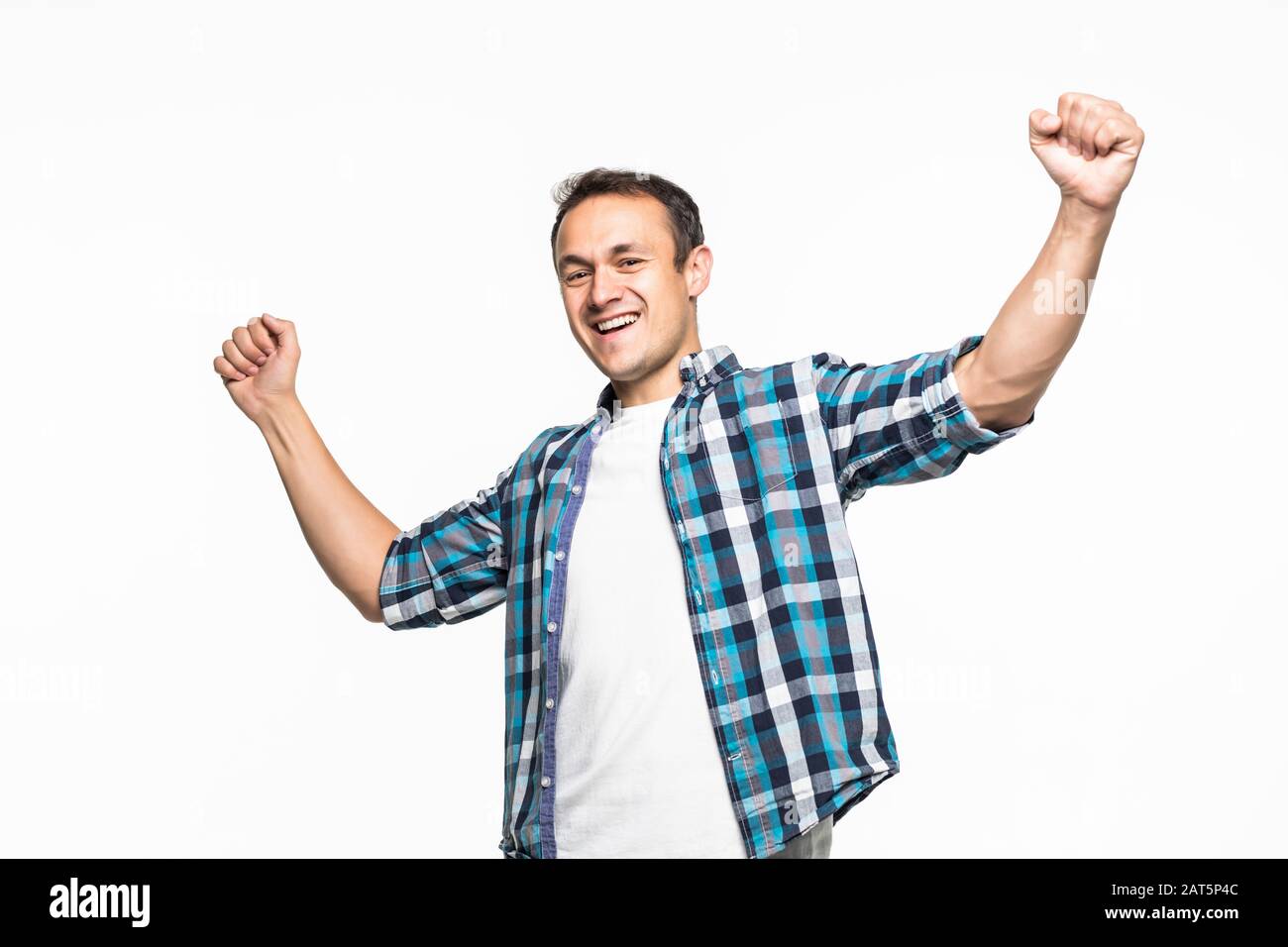 Happy winner. Happy young handsome man gesturing and keeping mouth open ...