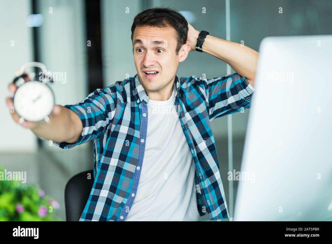 Business people working in office. Business man looking at clock an ...