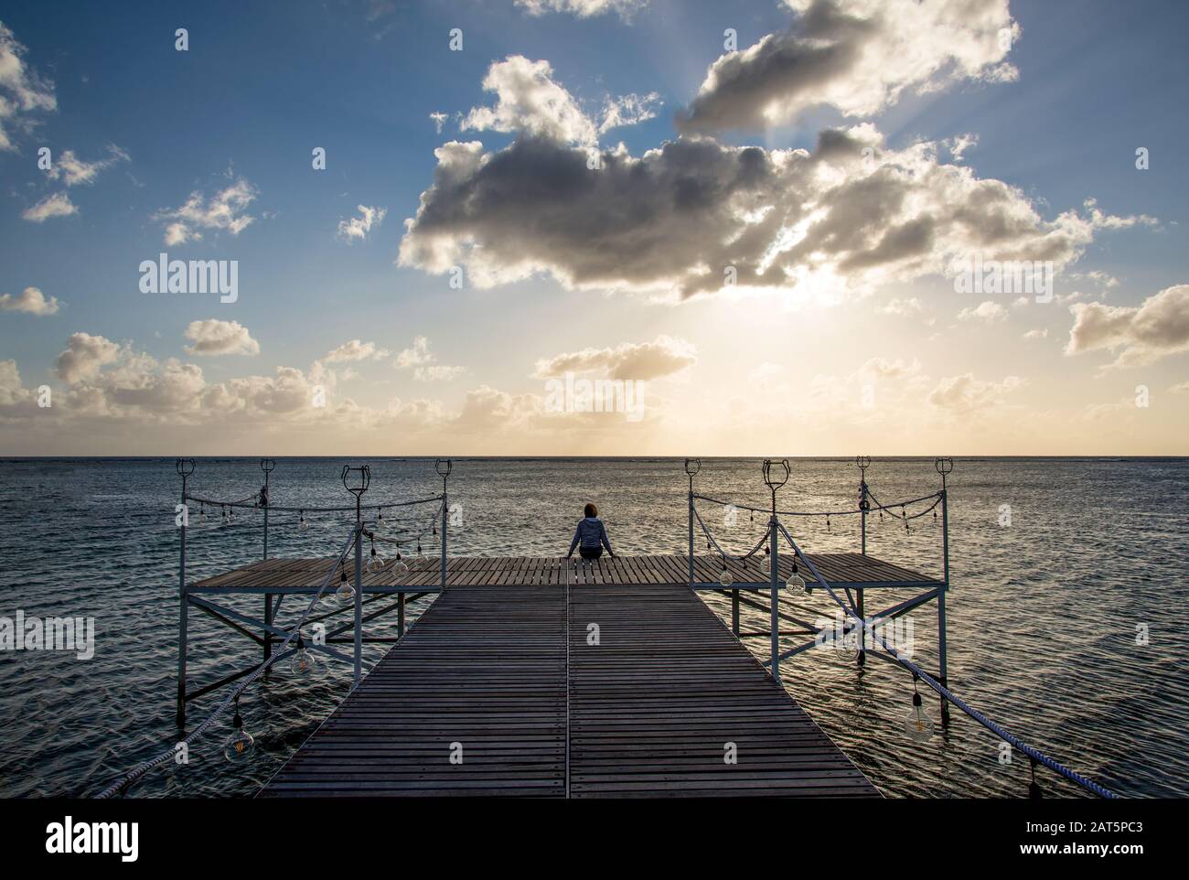 Jetty on the west coast of Mauritius at sundown Stock Photo - Alamy