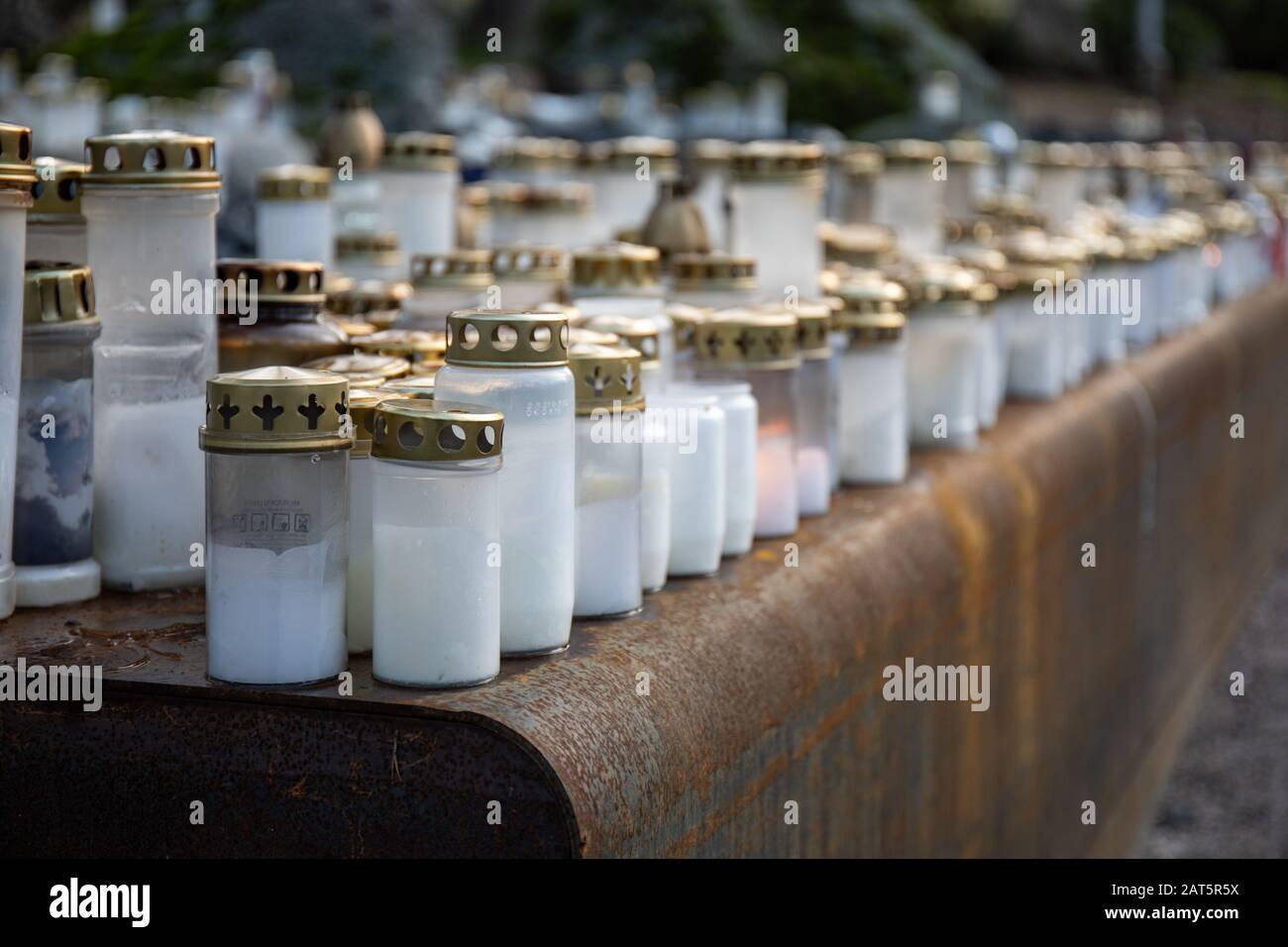 Grave candles at cemetery's remembrance place for those buried ...