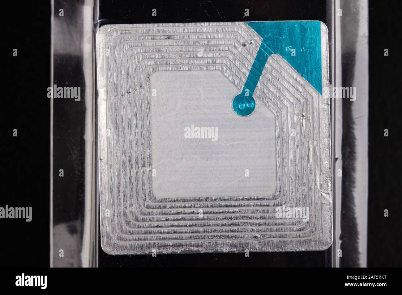 Sticky security chip to the packaging of the goods in the store. A ...