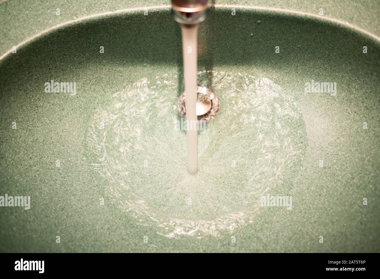 running tap water in bathroom Stock Photo - Alamy