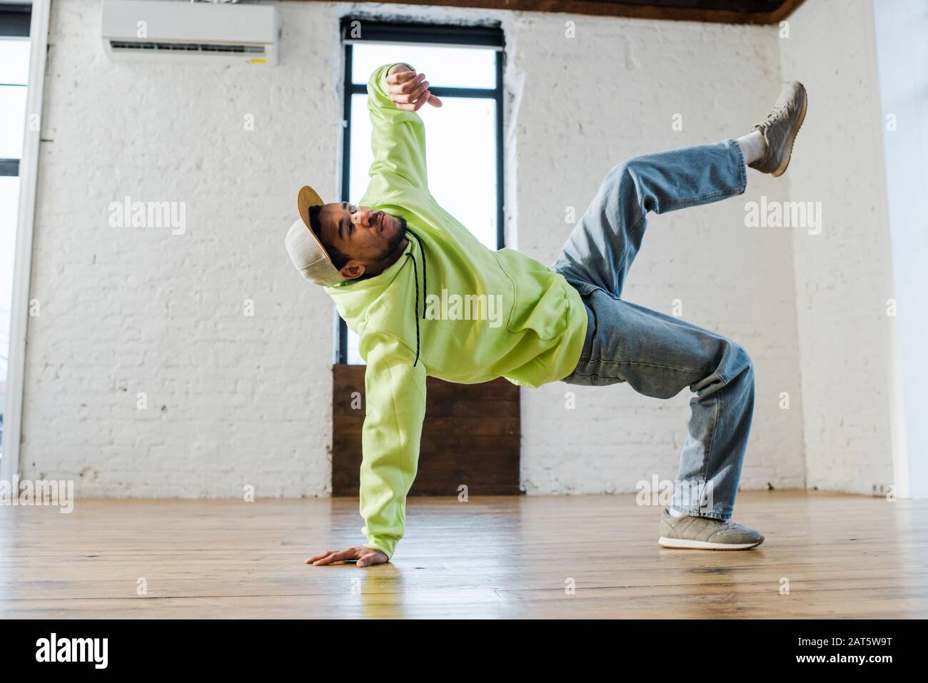 stylish african american man breakdancing in dance studio Stock Photo ...
