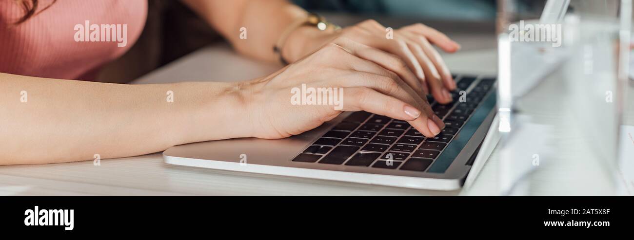 panoramic shot of art director typing on laptop keyboard Stock Photo ...