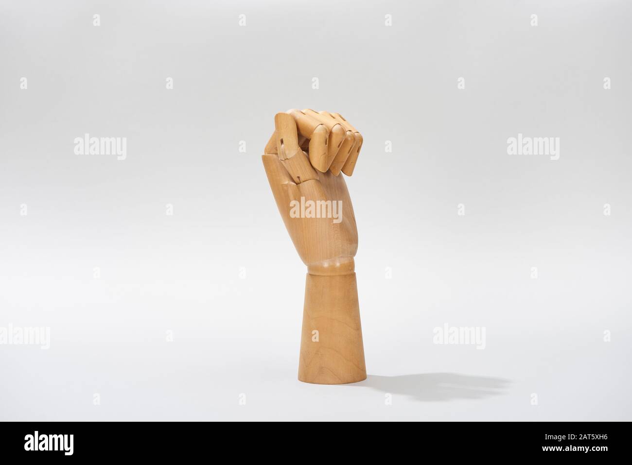 Wooden hand of puppet on grey background with copy space Stock Photo ...