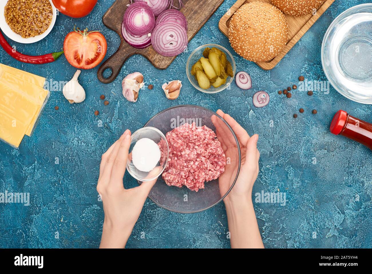 Woman adding salt to food hi-res stock photography and images - Alamy