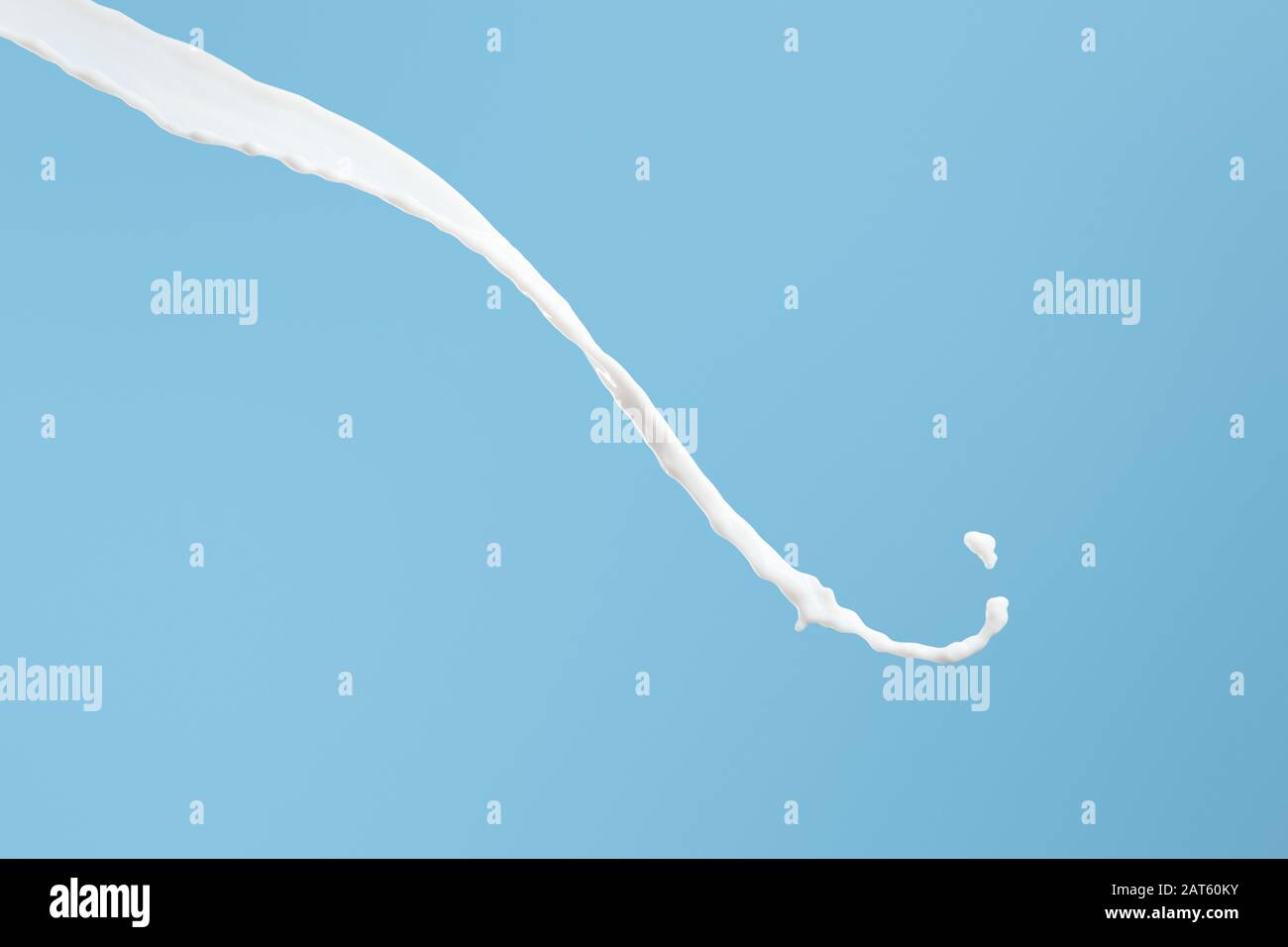 fresh white milk splash isolated on blue Stock Photo - Alamy