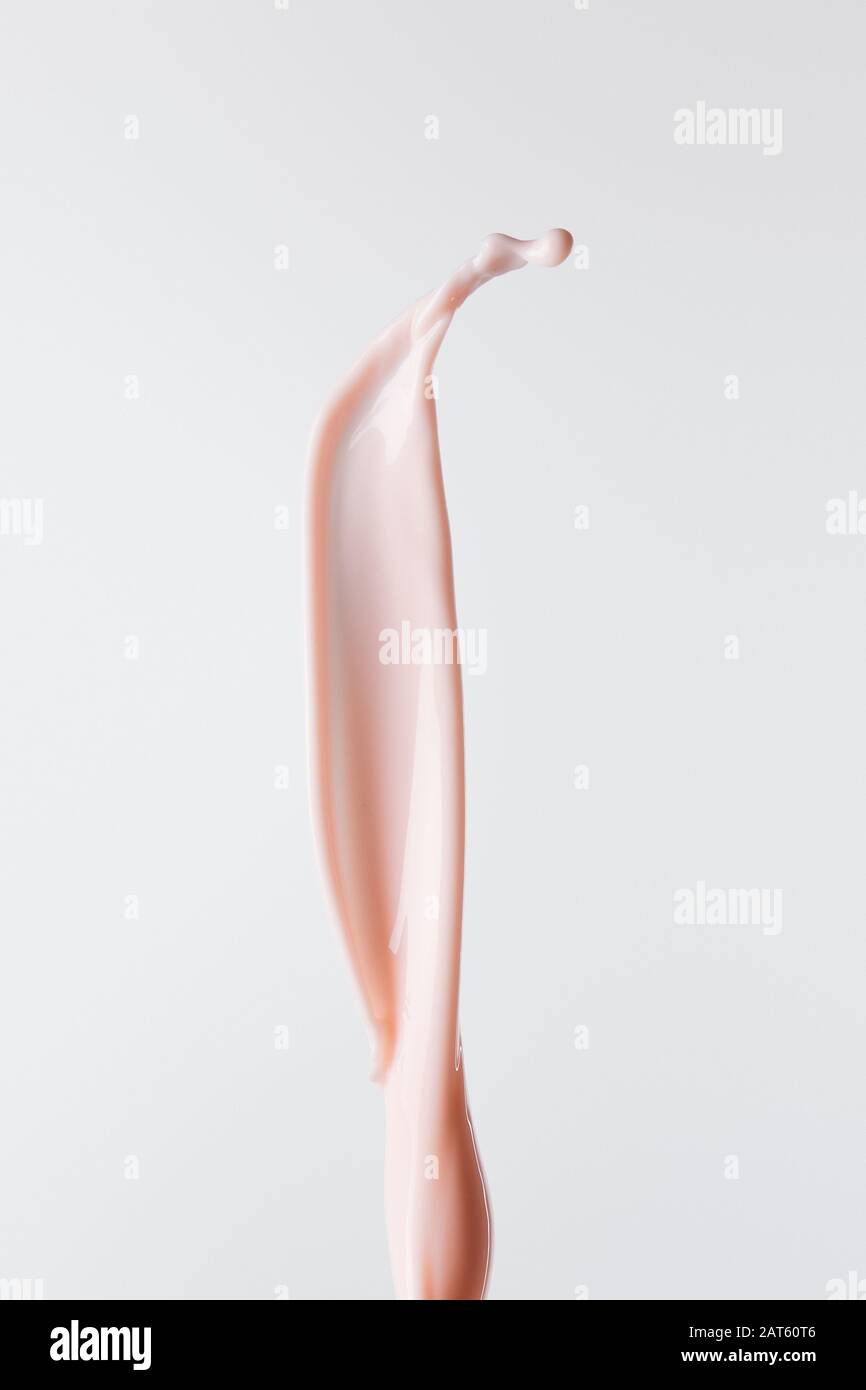 fresh pink milk splash isolated on white Stock Photo - Alamy