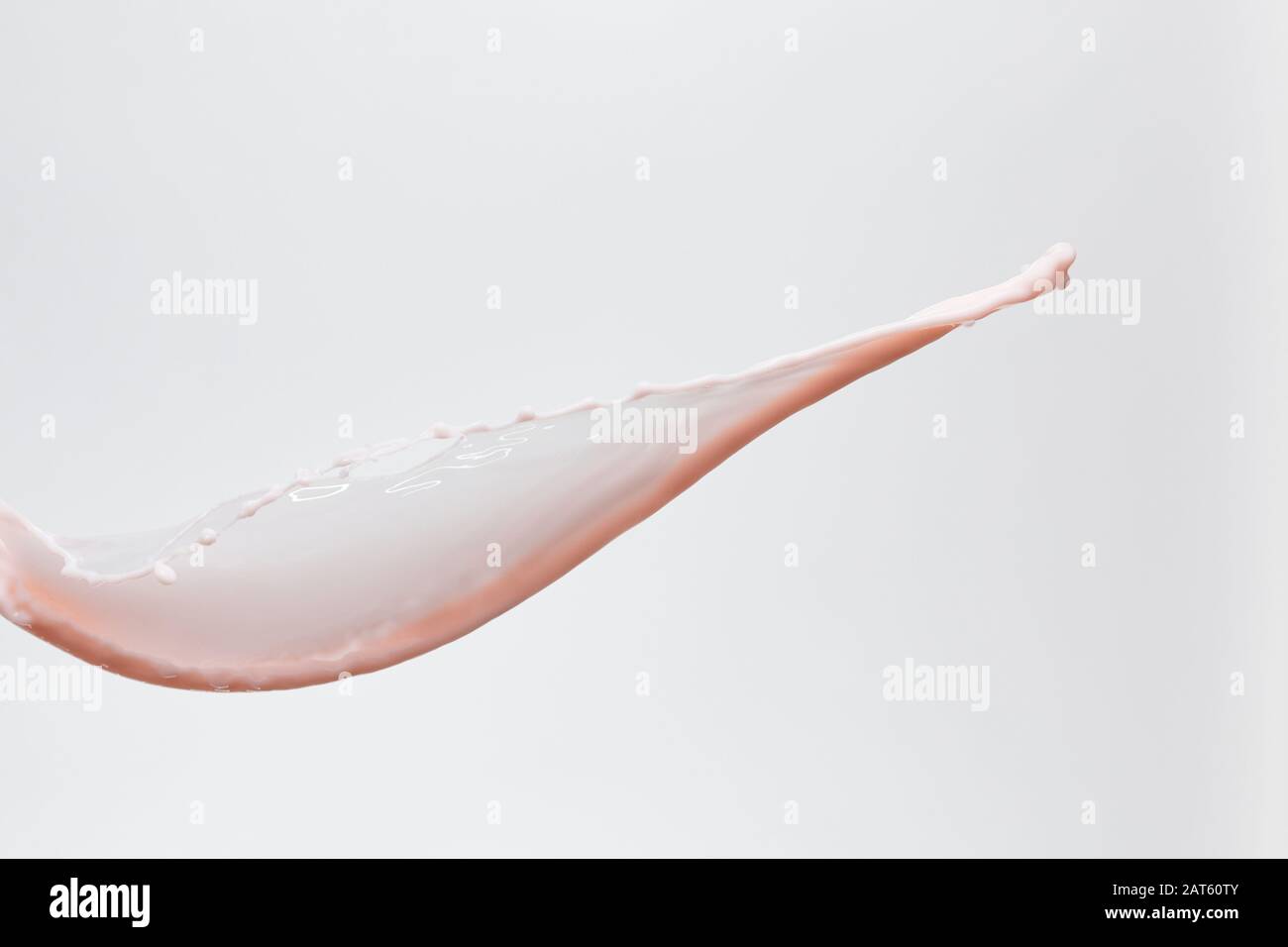 fresh pink milk splash isolated on white Stock Photo - Alamy