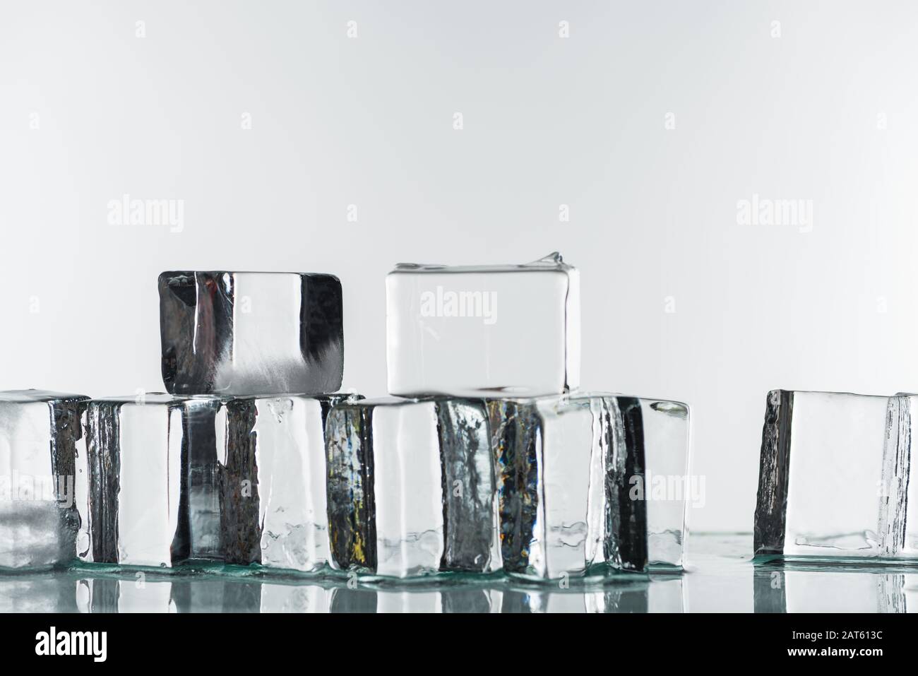 melting transparent clear square ice cubes isolated on white Stock ...