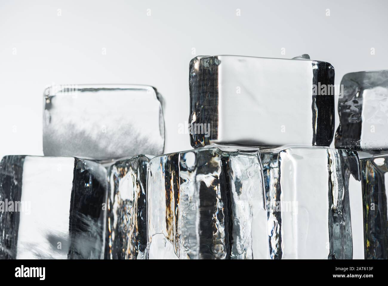 close up view of melting transparent clear square ice cubes isolated on ...