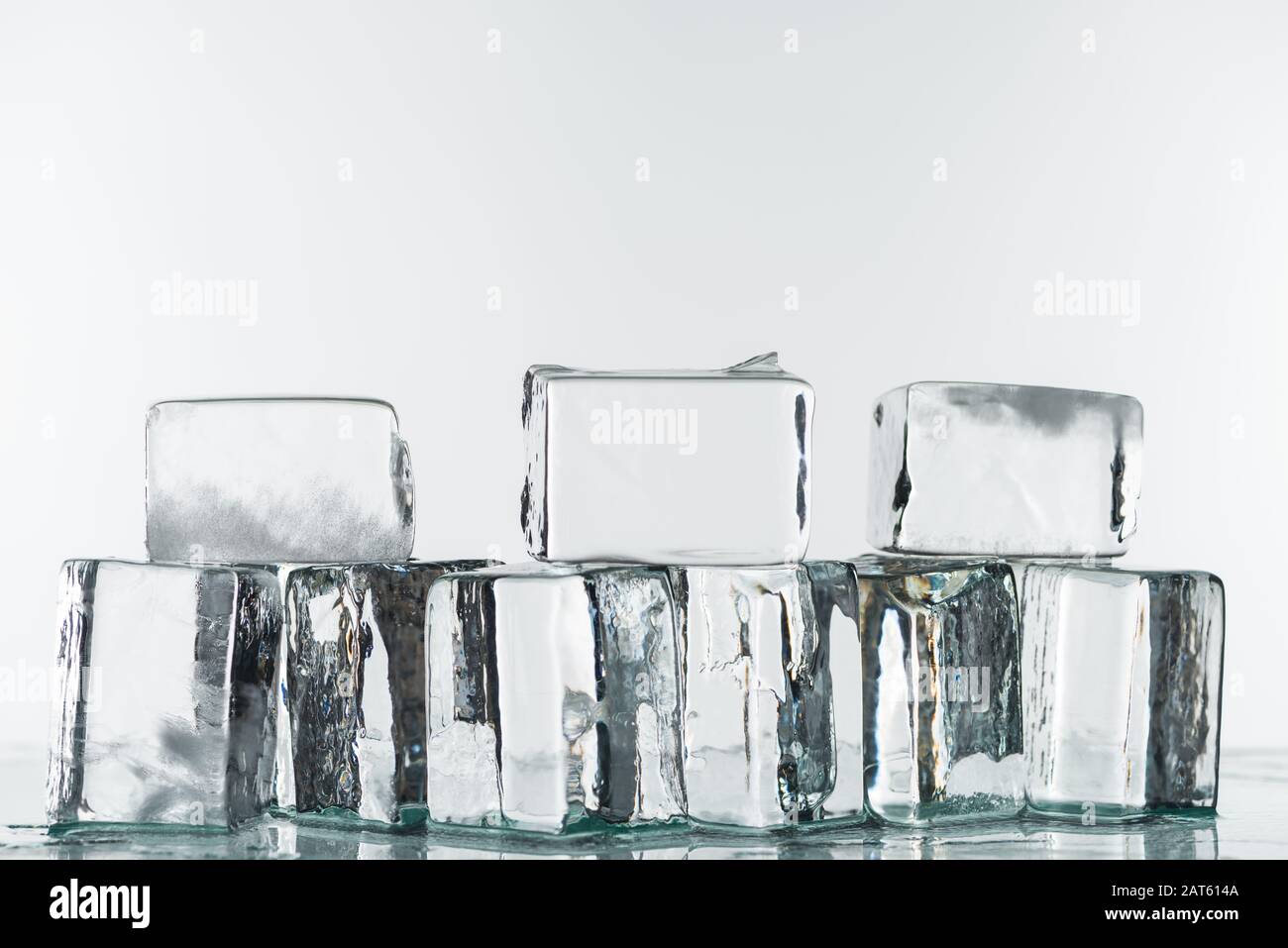 melting transparent clear square ice cubes isolated on white Stock ...