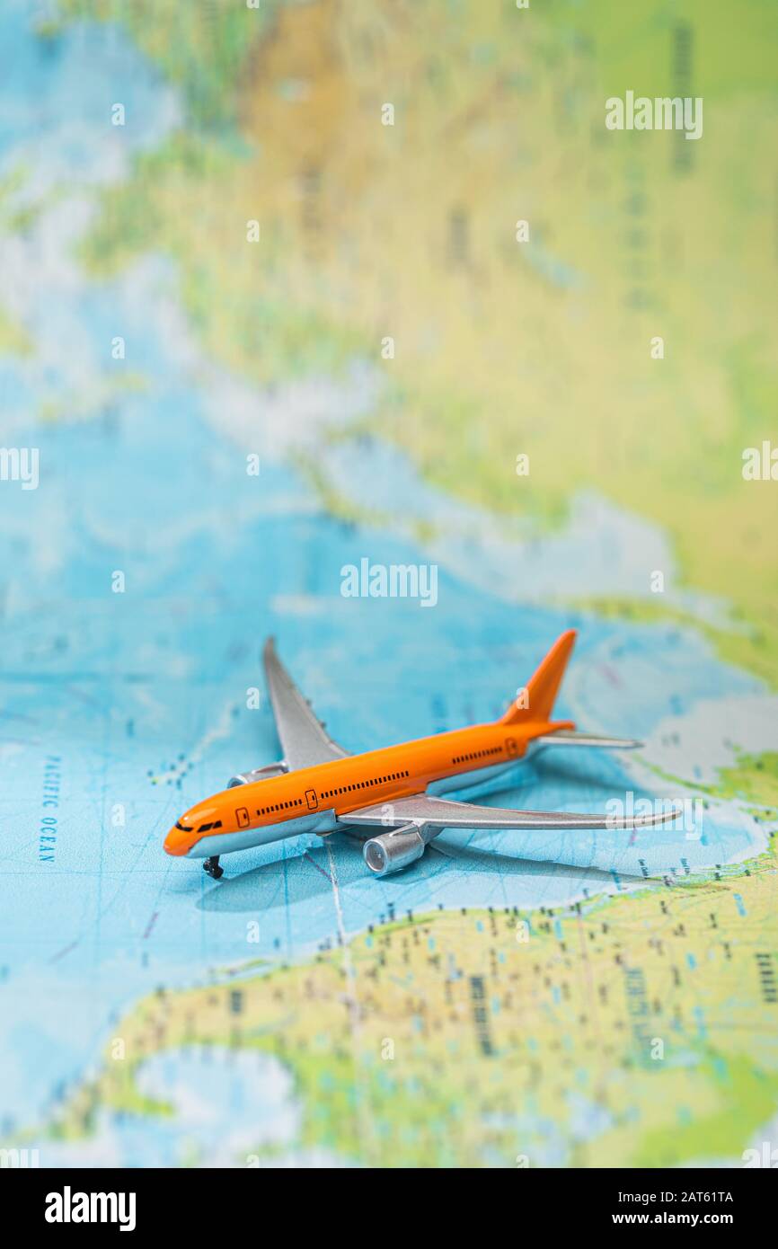 selective focus of small plane on world map Stock Photo - Alamy