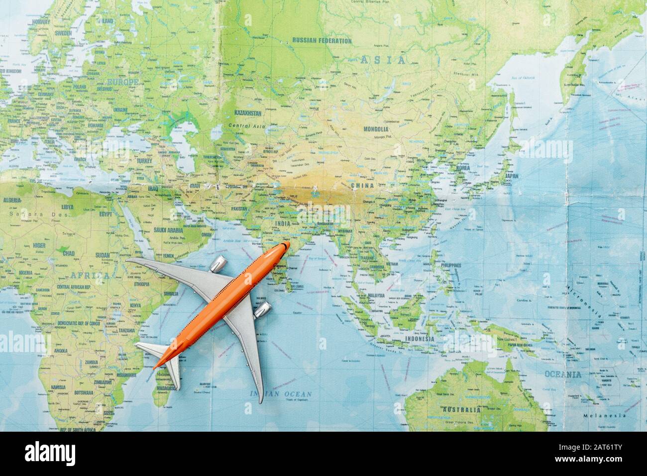 top view of small plane on world map Stock Photo - Alamy