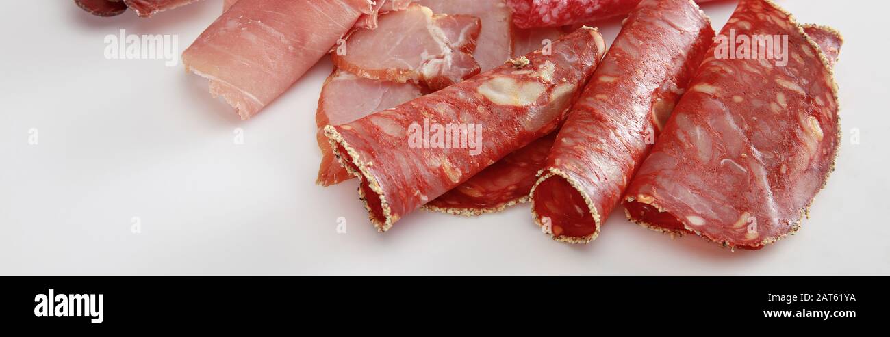 fresh delicious assorted sliced meat isolated on white, panoramic shot ...
