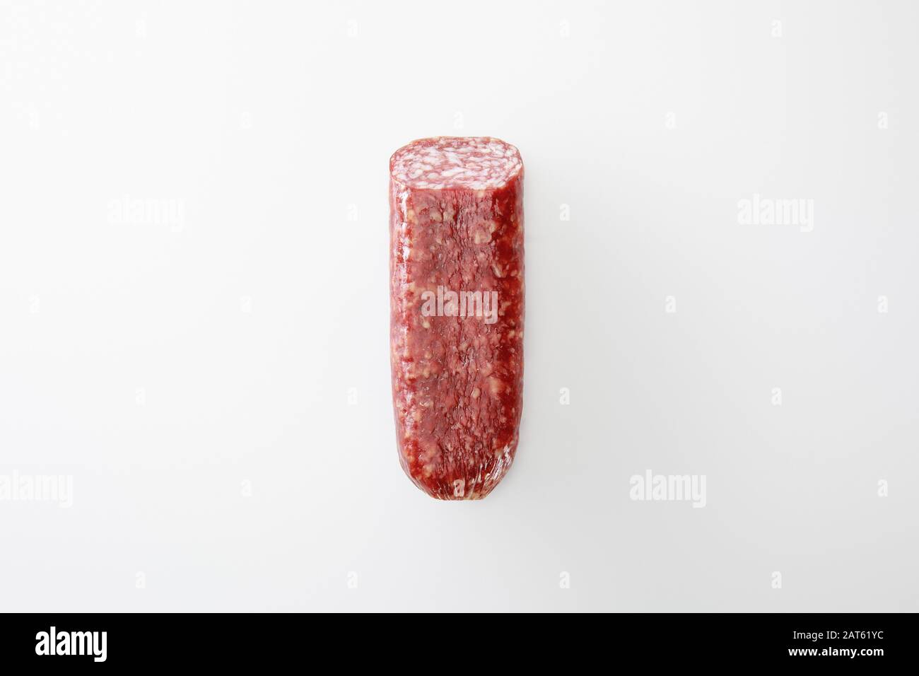top view of delicious whole salami isolated on white Stock Photo - Alamy