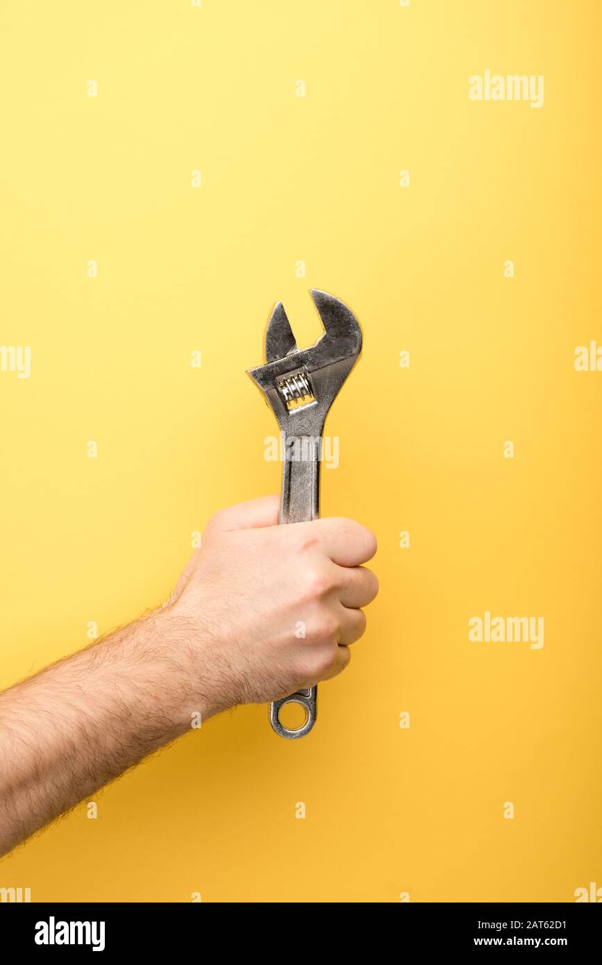 Man holding spanner hi-res stock photography and images - Alamy