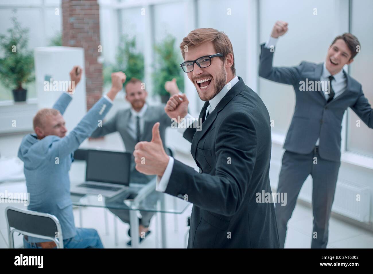 close up. happy boss standing in the office Stock Photo - Alamy