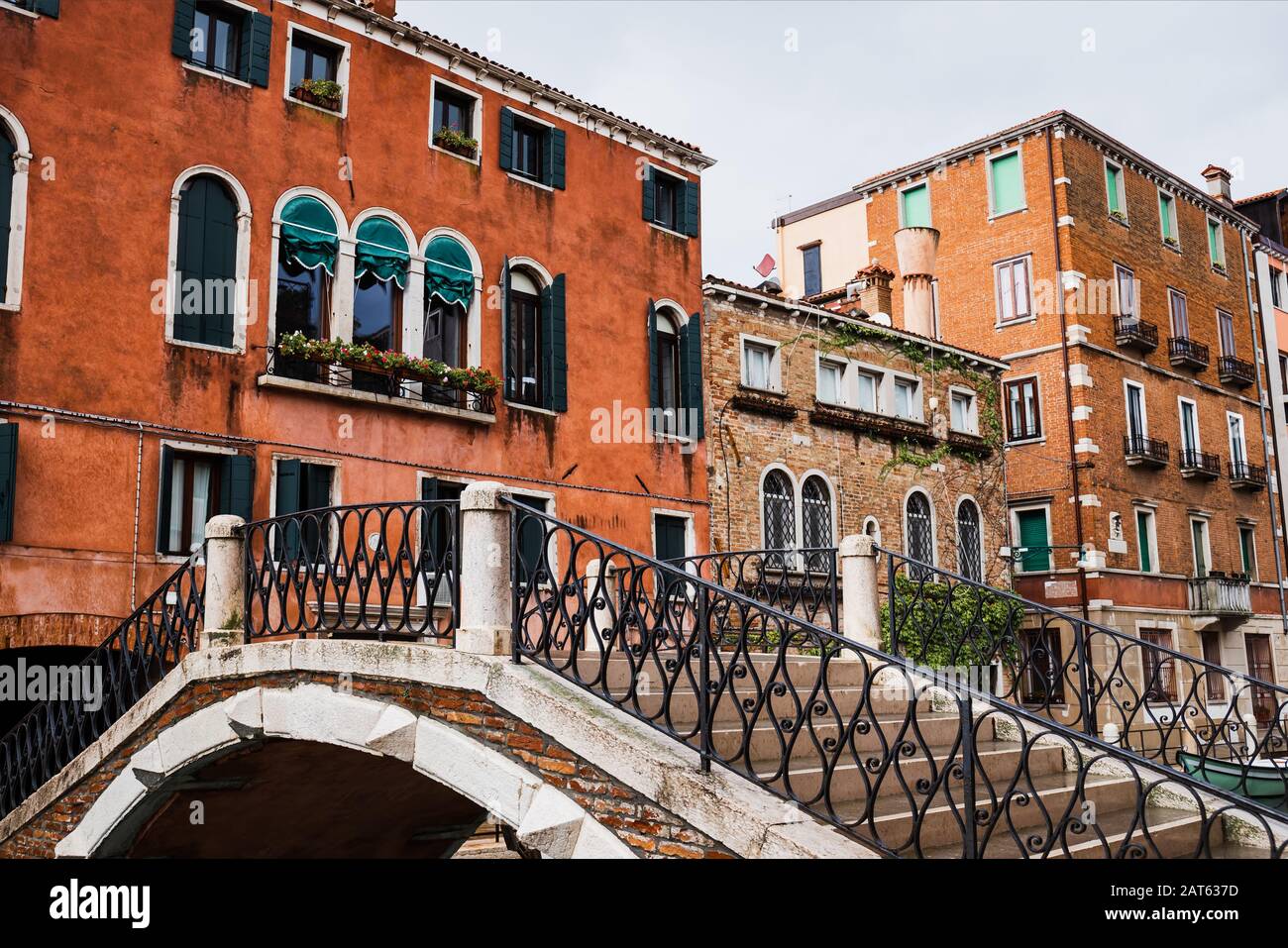 bridge and ancient buildings with plants in Venice, Italy Stock Photo ...