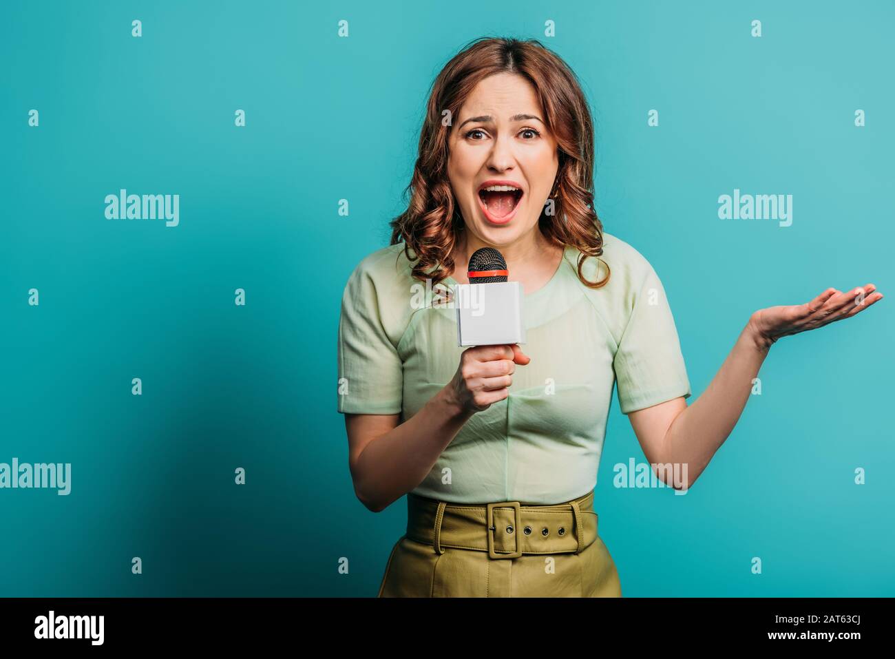 angry journalist standing with open arm while screaming in microphone ...