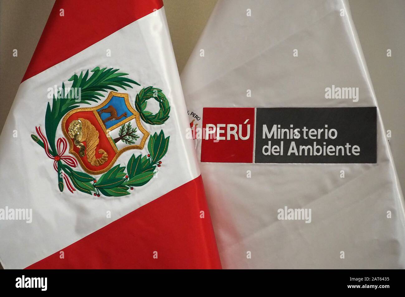 Peruvian flag and banner of the Ministry of Environment exposed in a ...