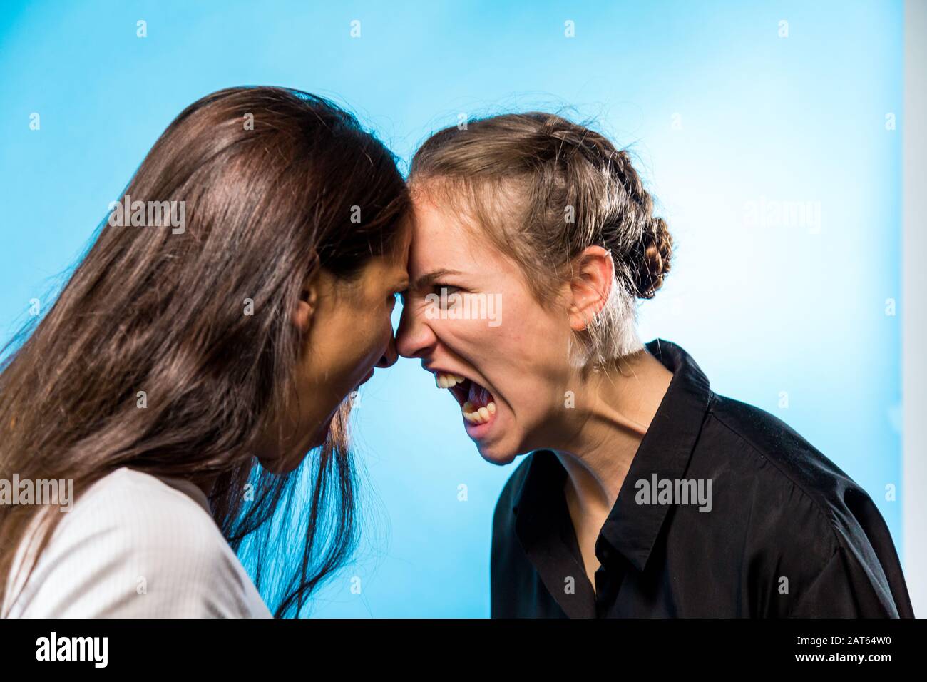 Two people screaming at each other hi-res stock photography and images - Alamy