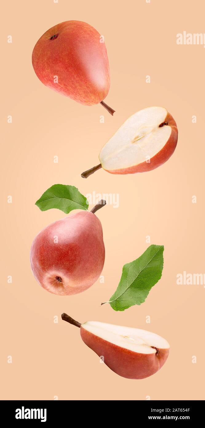 Floating pear fruits isolated on coloured background Stock Photo - Alamy