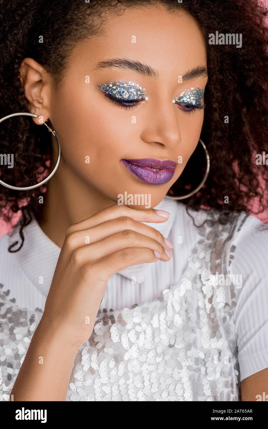 smiling african american girl with silver glitter eyeshadows and purple ...