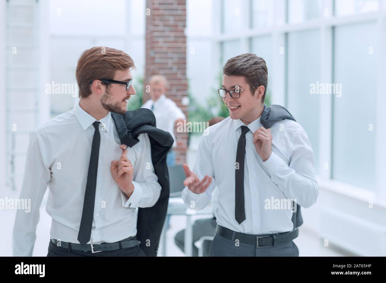 business colleagues discussing something in the workplace Stock Photo ...