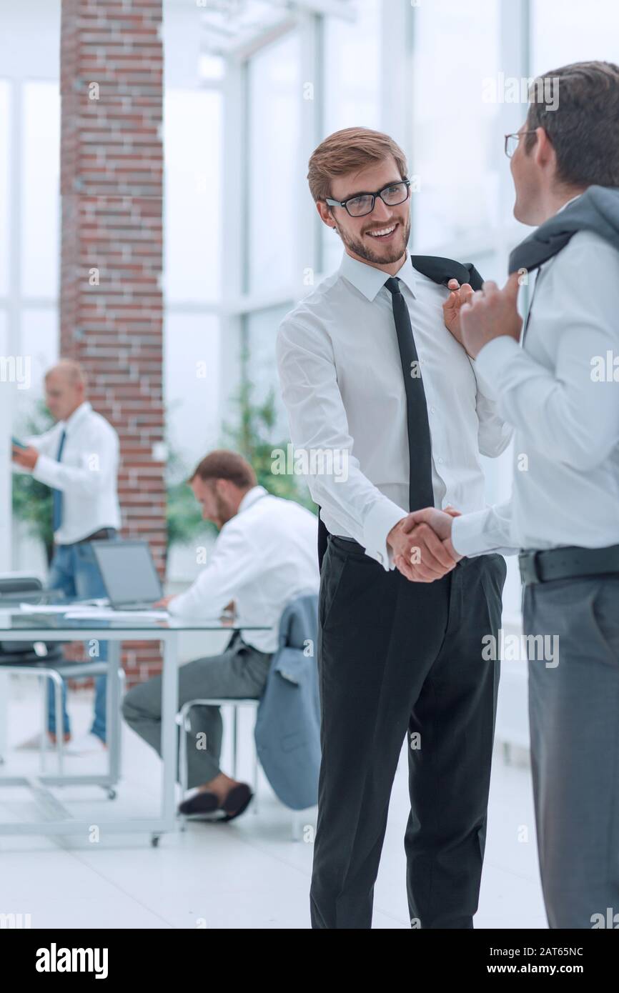 colleagues greeting each other with a handshake Stock Photo - Alamy