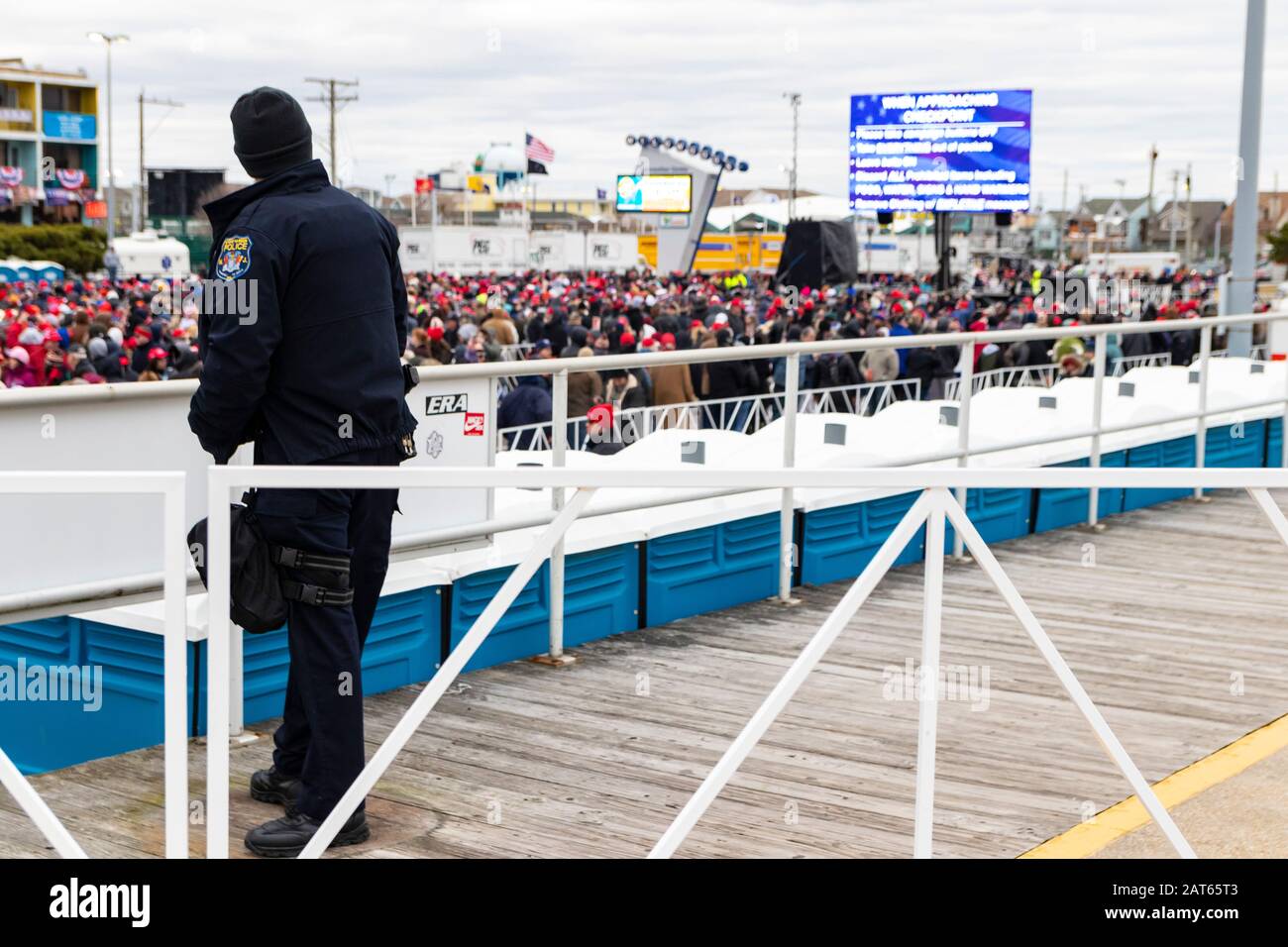 Police monitor large crowd waiting outside near the New Jersey shore ...