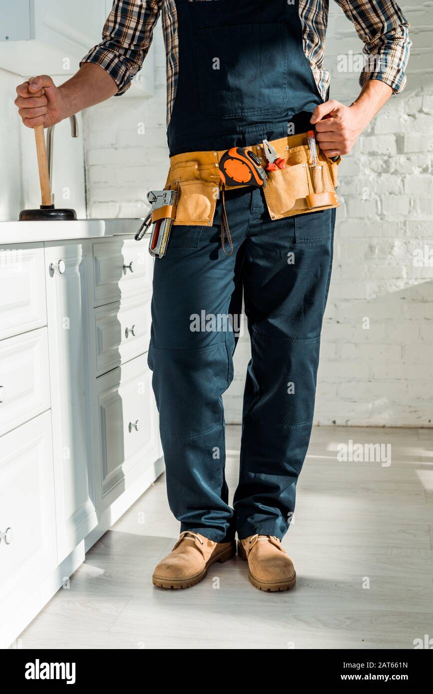 Plumber plunger tool belt hi-res stock photography and images - Alamy