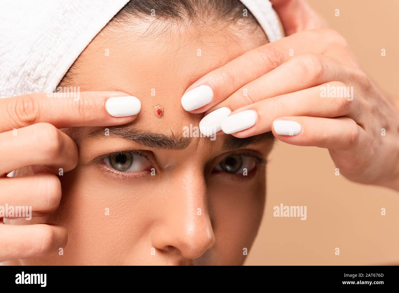 Woman squeezing spot hi-res stock photography and images - Alamy