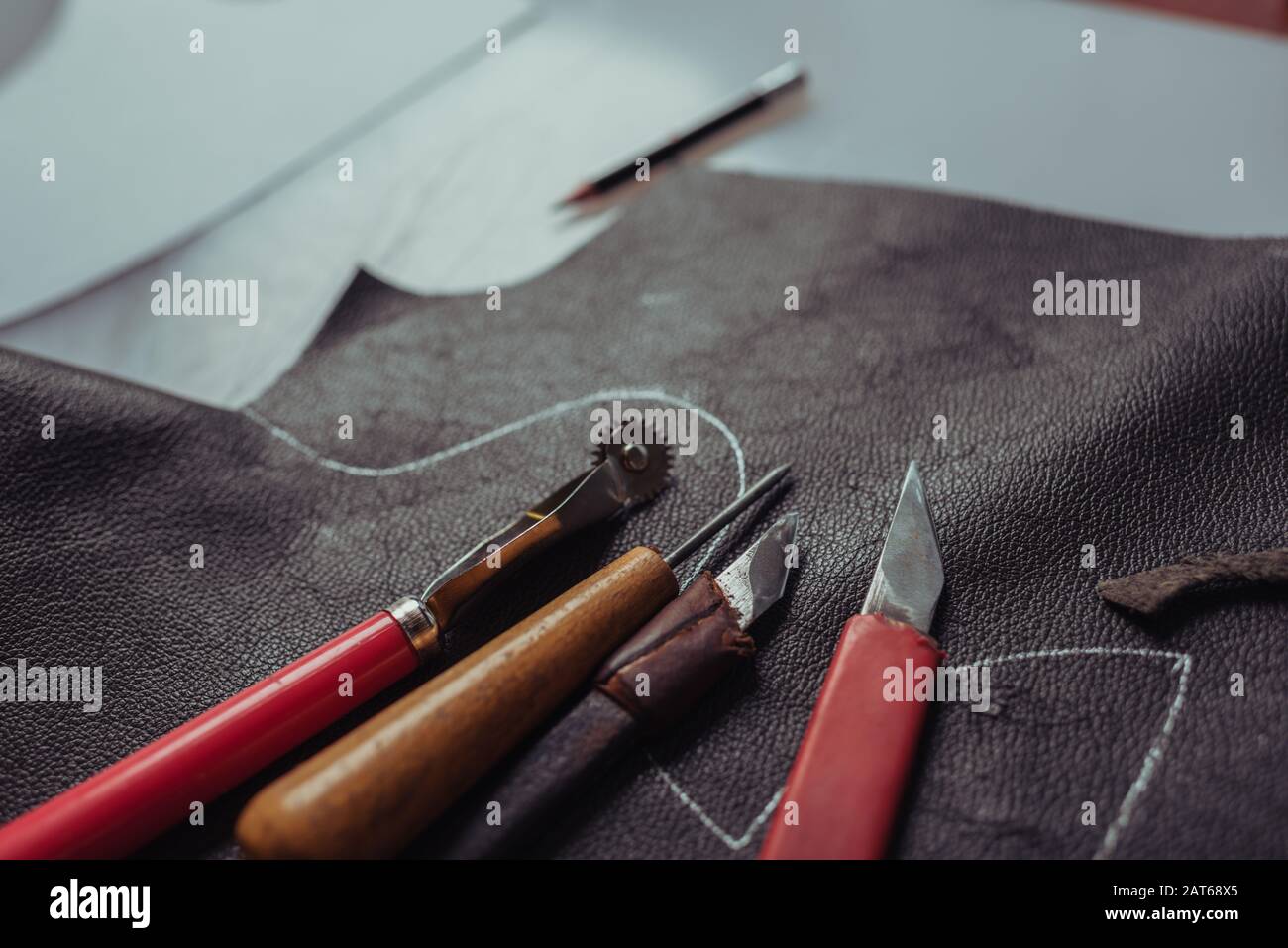 selective focus of different cutters and tracing wheel on piece of ...