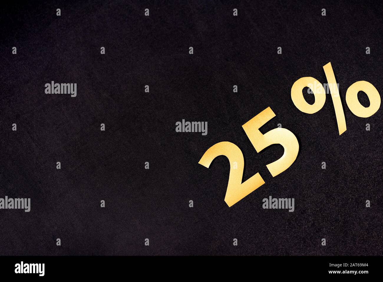top view of golden 25 percent signs on black background Stock Photo - Alamy