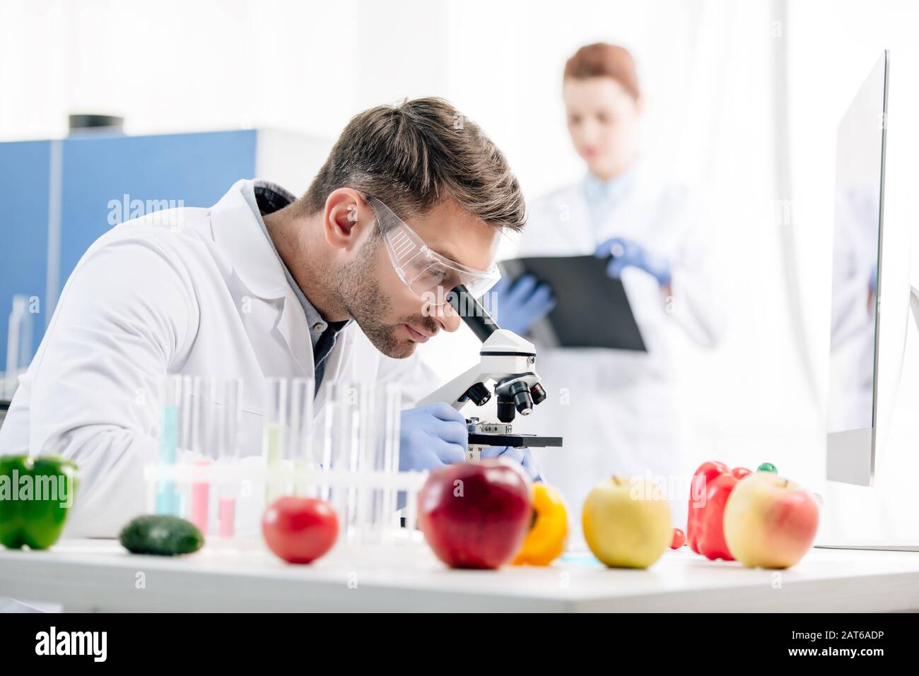 selective focus of molecular nutritionist using microscope in lab Stock ...