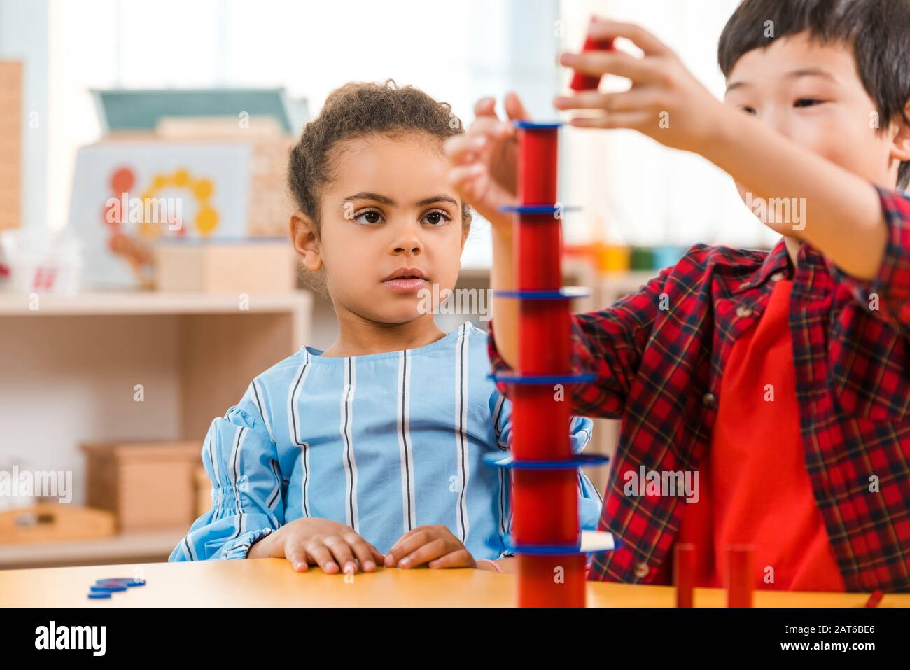Selective focus of kids playing game during lesson in montessori school ...