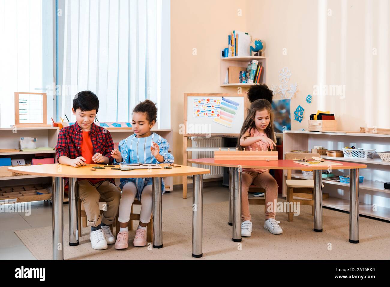 Kids playing during lesson in montessori school Stock Photo - Alamy