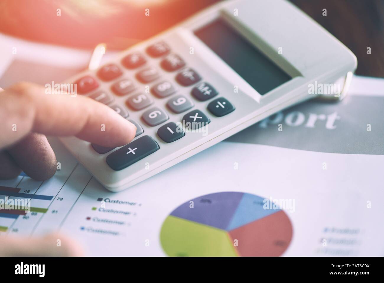 Business man using calculator for report financial statistics documents ...