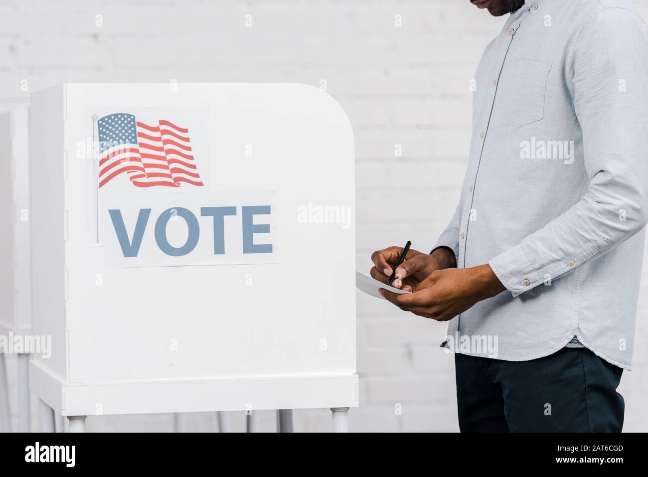 African american hold voting ballot hi-res stock photography and images ...